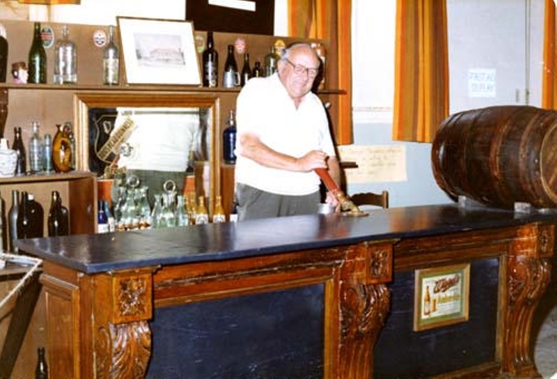 M-L79 Les Chamberlain behind the hotel bar NgNo 359-22; DHS-1064 | eHive