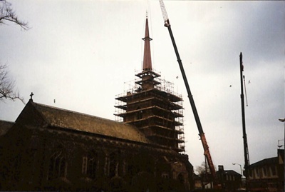Crane lifting the new spire onto St Peter's and St Mary's Church on ...