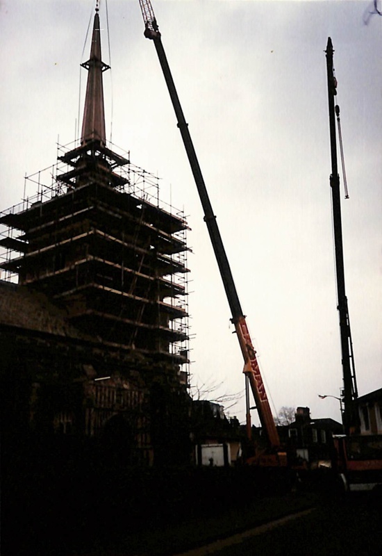 Crane lifting the new spire onto St Peter's and St Mary's Church on ...