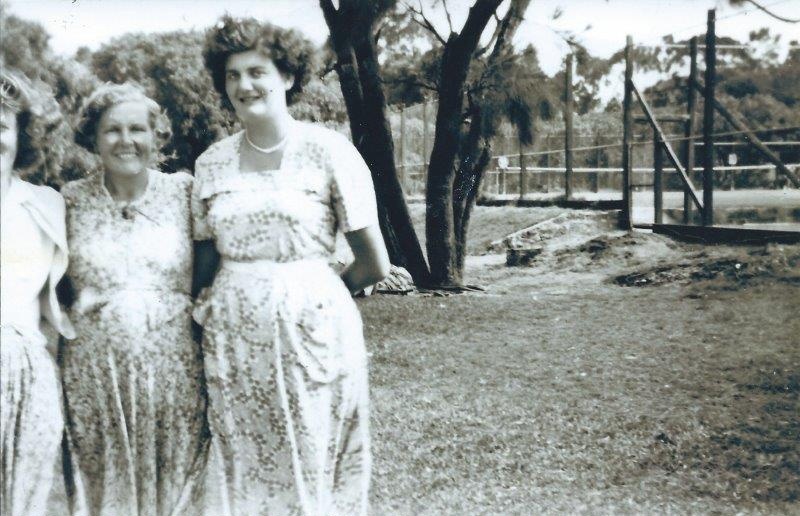 Three ladies beside the tennis courts, Kay Howson on right; 1950's ...