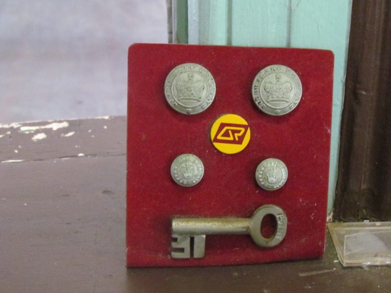 Railway Uniform Buttons and Point Key, on display board; A-0004 | eHive