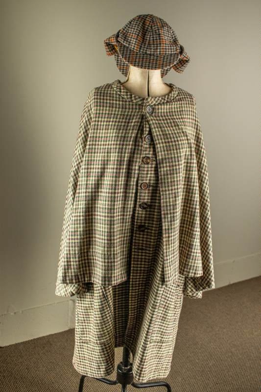 Man's check, collarless overcoat with cape. Deer stalker hat Ch 100 ...