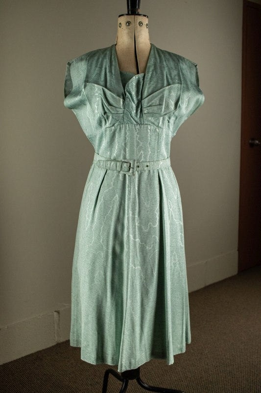 Pale silvery-green satin dress with ruched bust, midriff section and ...