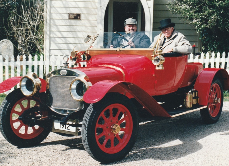 Geoffrey Fairfield, in black top hat, a passenger in the 1912 vintage ...