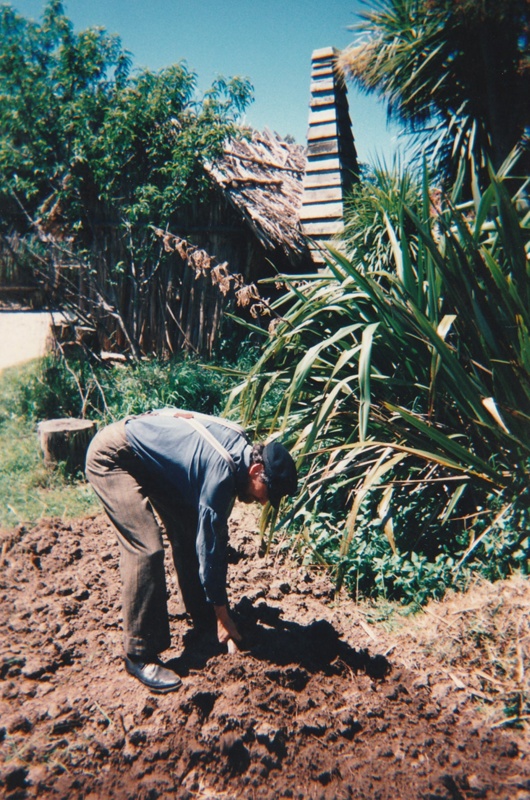 A man in costume digging a garden in Howick Historical Village. ; La ...