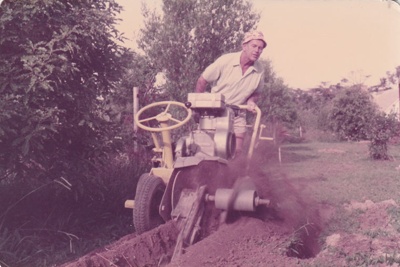 John Litten digging a trench for post office telephone lines at Howick ...
