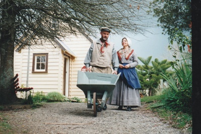 Richard Lees with a wheelbarrow and Barbara Doughty in costume outside ...