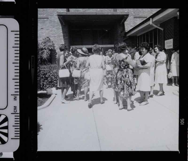 Photograph - Large group of women milling outside Crown Lynn factory ...