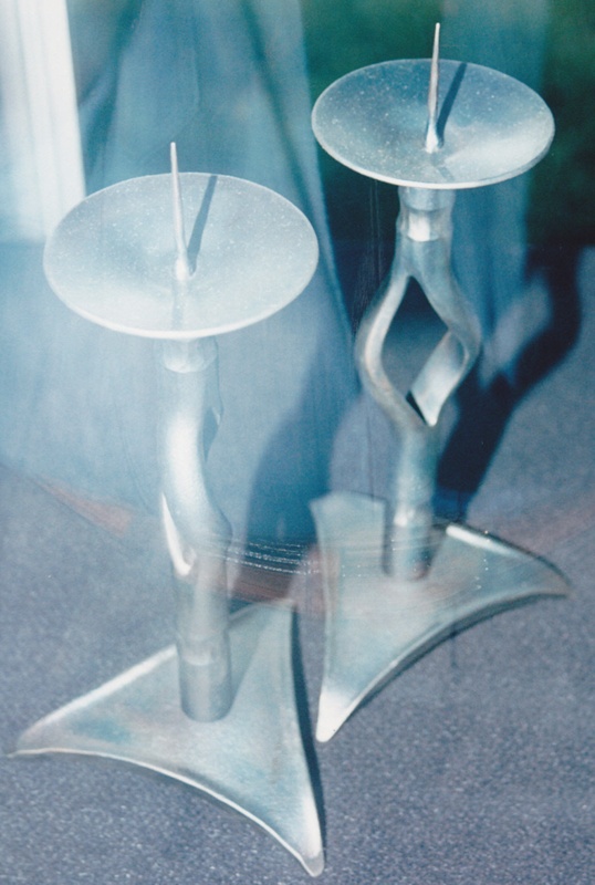 Two silver-coloured metal candlesticks. ; 1997; 19938 | eHive