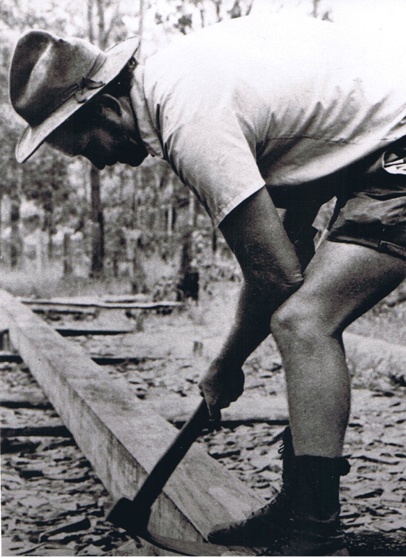 Photograph - Man hand adzing a piece of timber. ; 8622 | eHive