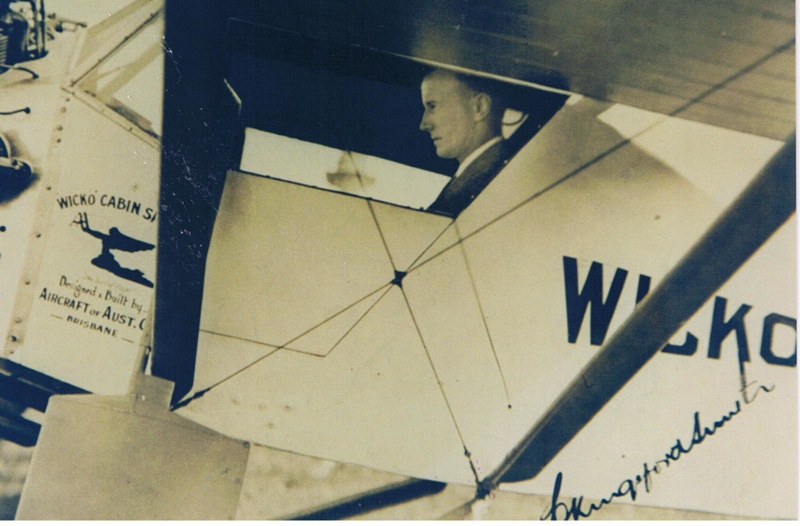 Kingsford Smith at the controls of a Wicko Cabin Sports aeroplane; 8024 ...