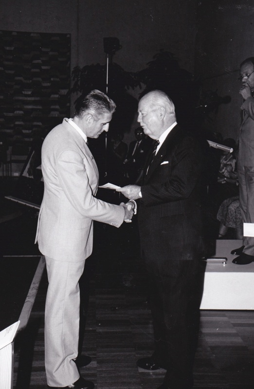 Photograph - Queensland Governor Sir James Ramsay presenting a man with ...