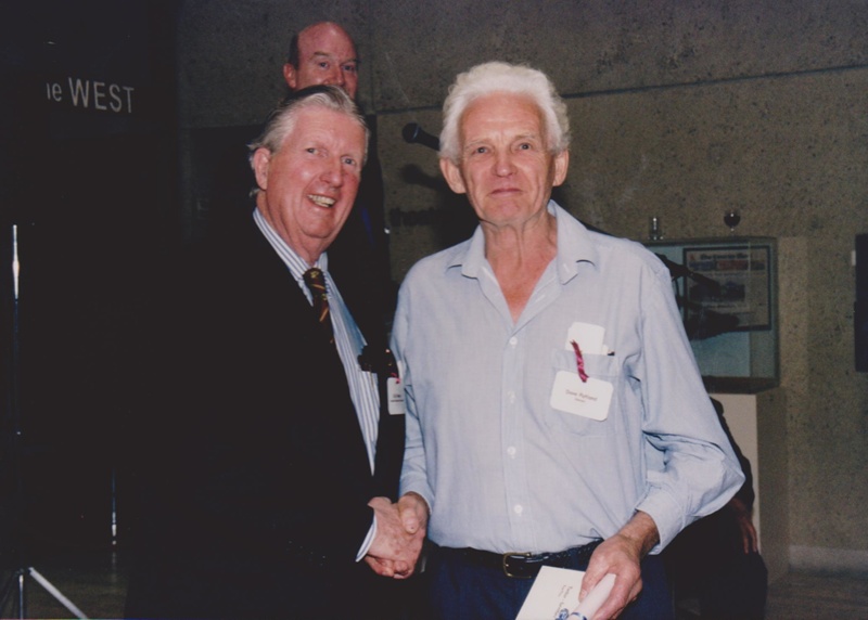 Photograph - Colin Munro hands an award to Dave Putland at the Dame ...