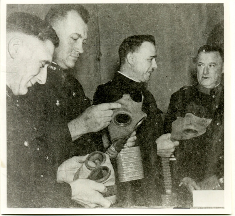 Instruction in correct fitting of gas masks during World War II; 1939 ...
