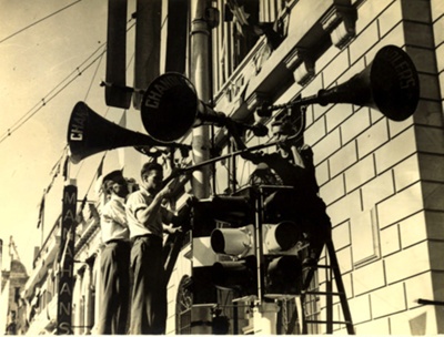 Close-up of traffic lights and loud speakers, corner of Queen and ...