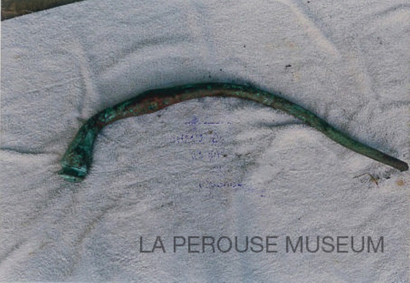 Colour print photograph of a bronze stanchion resting on a towel ...