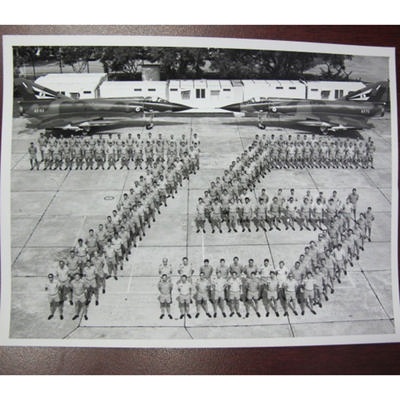 Members of 75 Squadron stand in formation of the number 75 with two ...