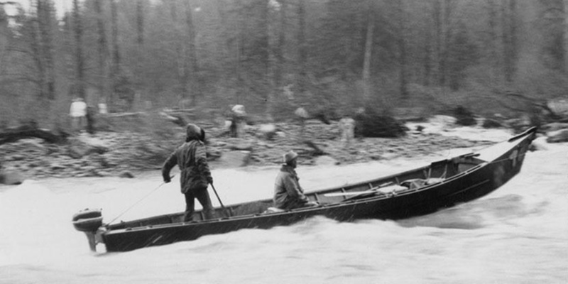 Everett Spalding and Prince Helfrich in a long boat on the McKenzie ...