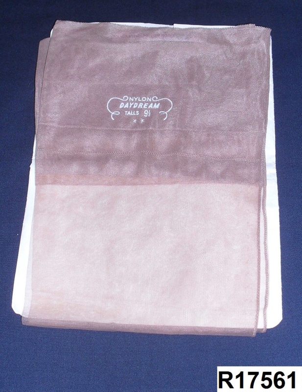 A pair of tan coloured nylon stockings with original cellophane ...