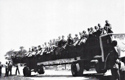 Photographs (2) of Daniel Benfer's timber truck with a large group of ...