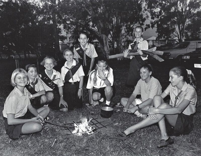 Photograph of Cleveland Girl Guides enjoying social time around a camp ...