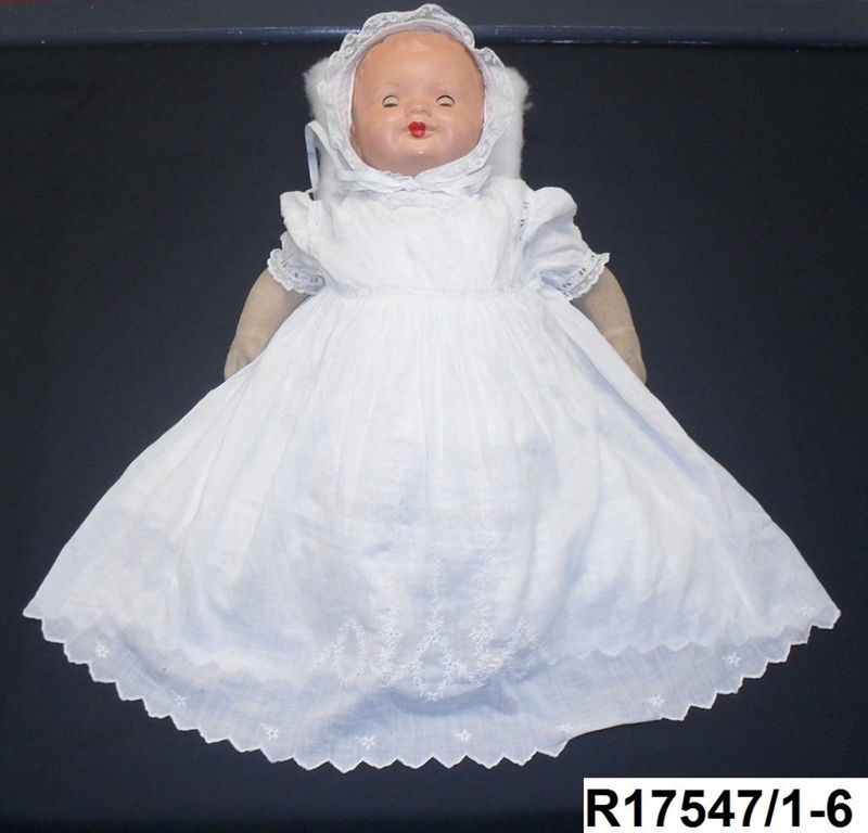 A "Barbara" doll with bisque head, cloth arms and legs. Doll can say ...