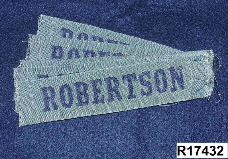 Nine fabric name tags; R17432 | eHive
