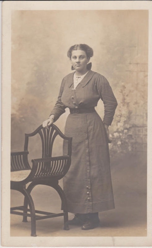 Photograph of an unknown girl and an antique chair (a Postcard to ...