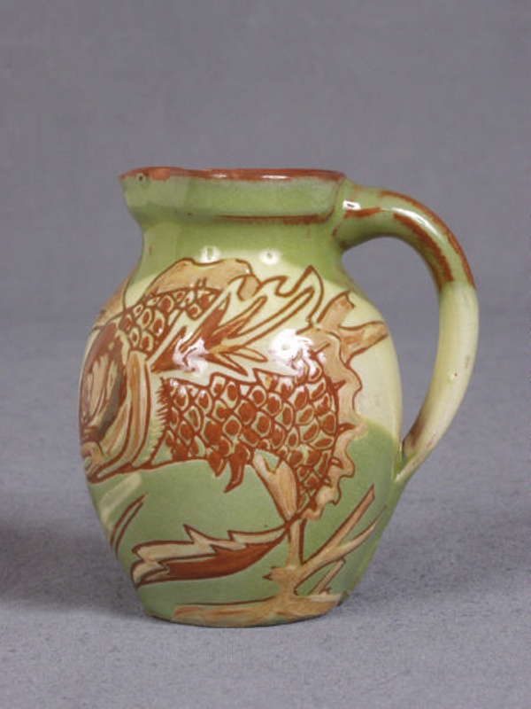 Small jug with pale green fish design 1896; 1896; 1991 | eHive