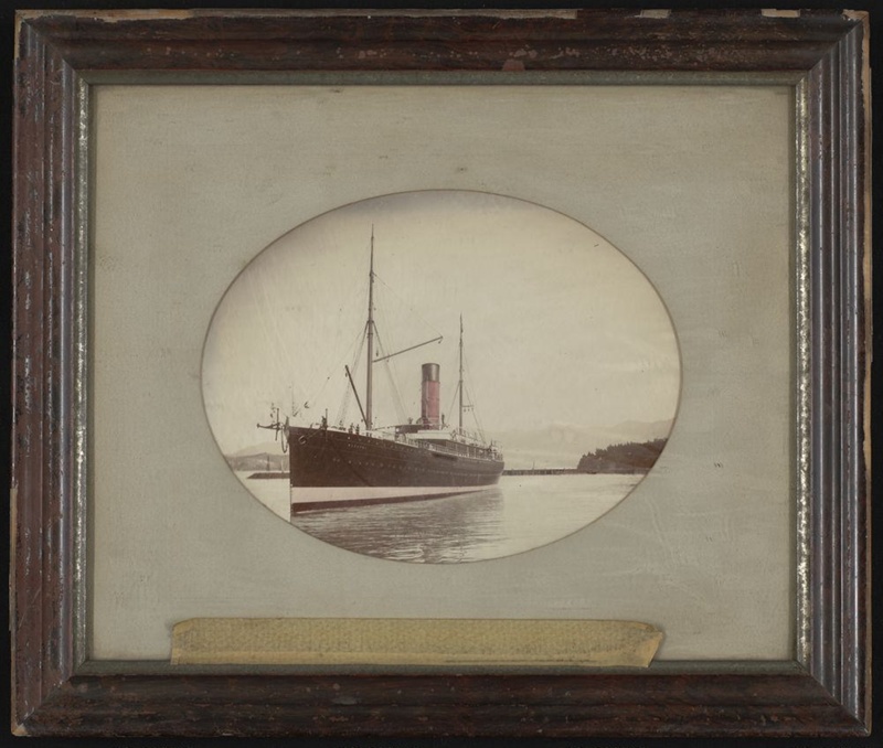 Hand-coloured image of the 'Mararoa' in Lyttelton Port. Glazed, wooden ...