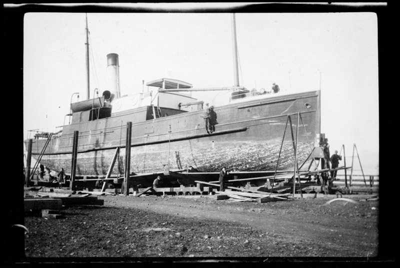 Ship in dry dock at Lyttelton Port. "KAPUNI" on bow, transcription ...