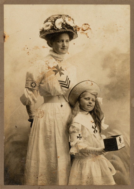 Portrait of unidentified woman and girl collecting for St John ...