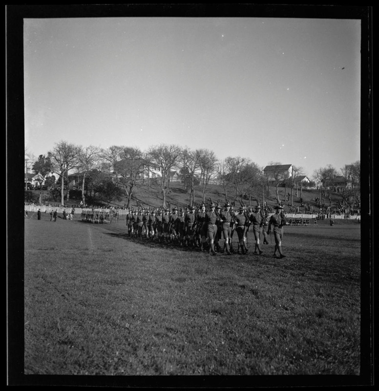 Young men marching in formation carrying rifles. cadets or scouts ...