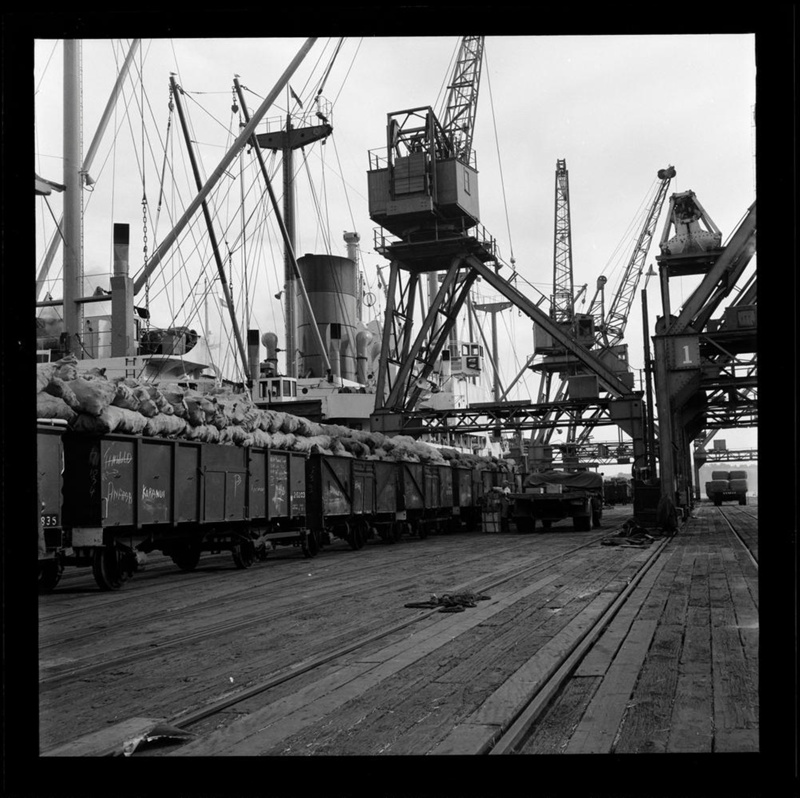Loading / unloading of a coke shipment in Lyttelton Port.; Unknown ...