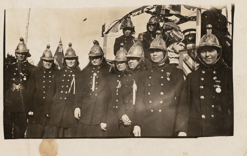 Group of men and women in fire brigade uniforms.; Unknown; 1900-1950 ...