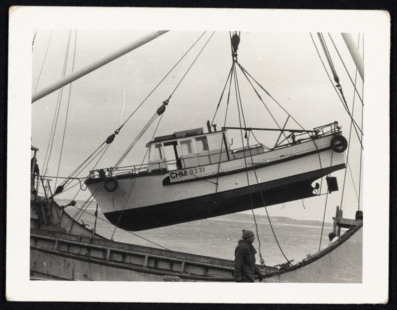 Lifting smaller boat onto ship.; Unknown; 1950-2000; 8963.1 | eHive