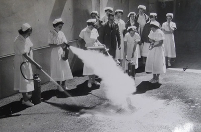 Nurses' fire extinguisher practice; AMP.17.49 | eHive