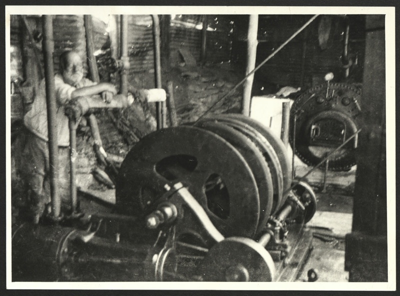 Photo of Reward Mine engine room with miner Mr J.H Groves; Unknown; c ...