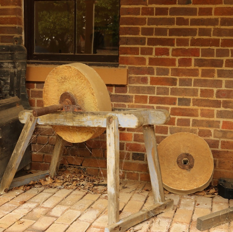 Grinding stone and stand; 89.345 | eHive