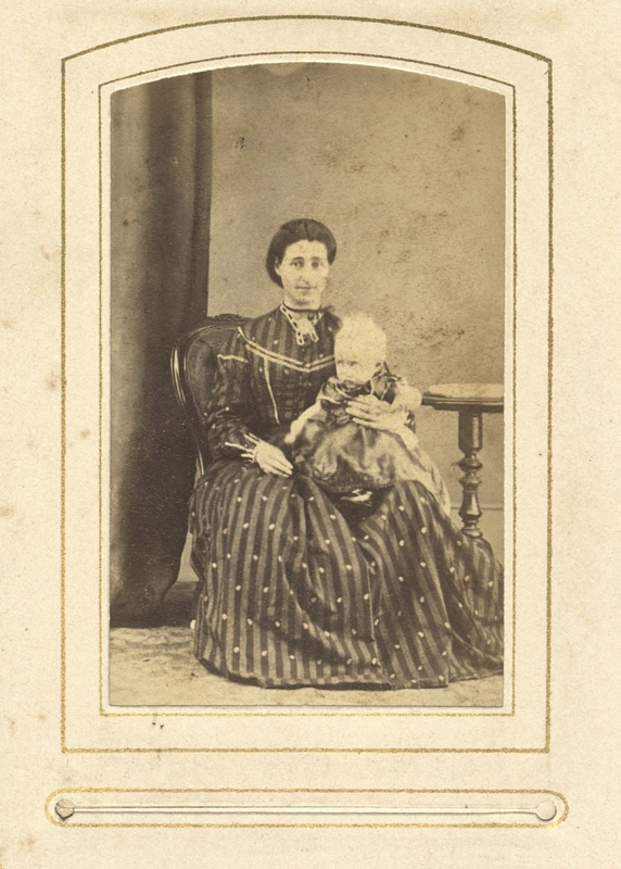 Studio photo of a mother and baby in a seated pose.; J.Hubert Newman ...
