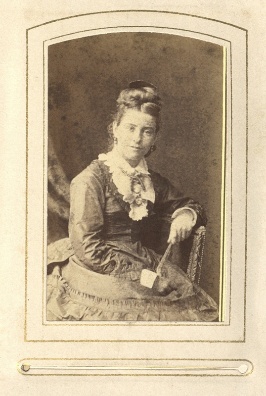 Studio photo of a seated lady in formal attire.; J.Hubert Newman ...