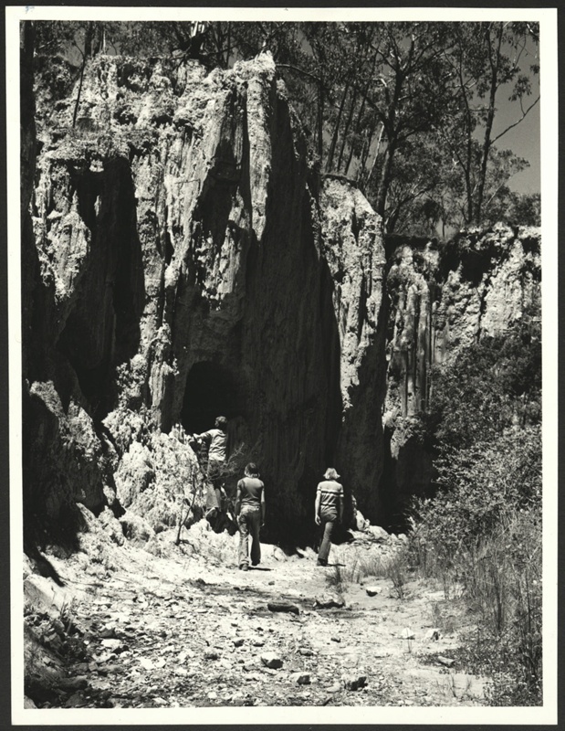 Photo of three boys walking through a small gorge described as Golden ...