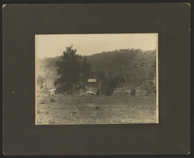 A mine site and aerial tramway towers with ore buckets built into the ...