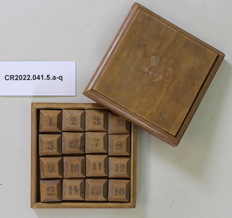 Wooden box with 16 individual numbers inside; CR2022.041.5 | eHive