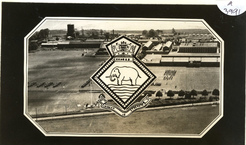 Postcard of the HMS Ganges badge superimposed on an aerial view of the ...