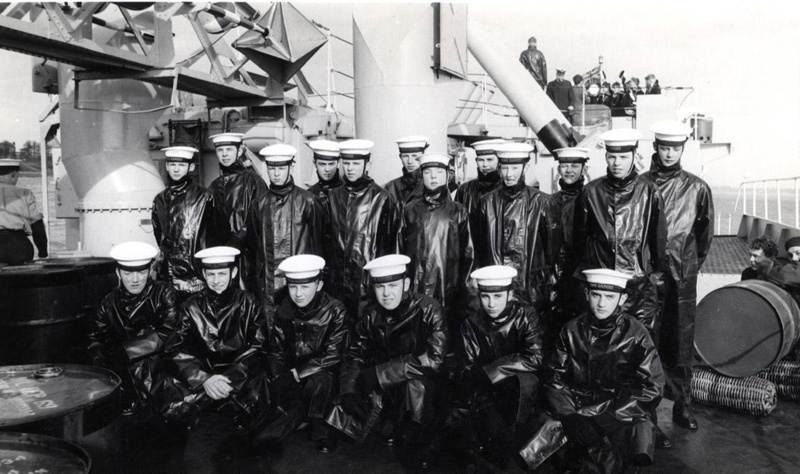 Photograph of a group of boys from HMS Ganges, dressed in oilskins ...
