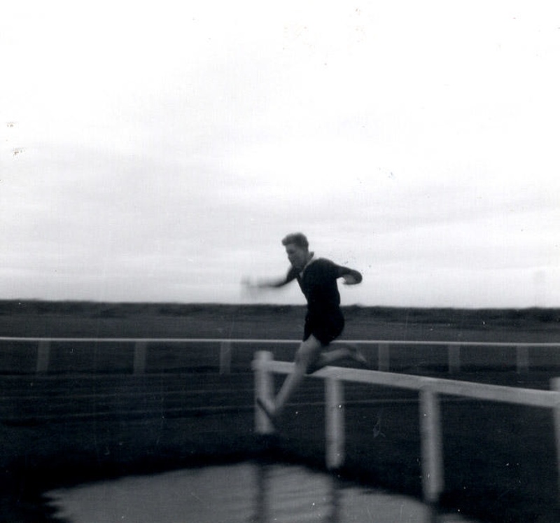 Photograph of Junior Terry Abrams competing in the steeplechase on ...