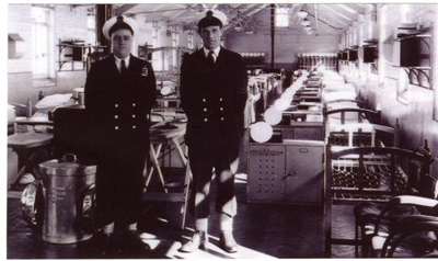An undated photograph of a mess deck showing an unknown Petty Officer ...