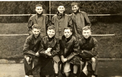 Photograph of seven boys dressed in oilskins, HMS Ganges; SHHMG:A1292 ...