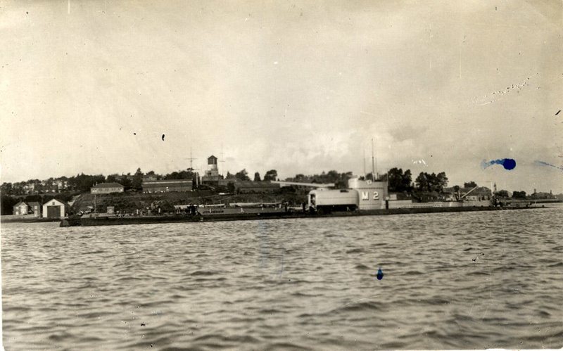 Photograph of Submarine M2 moored in front of HMS Ganges.; photographer ...